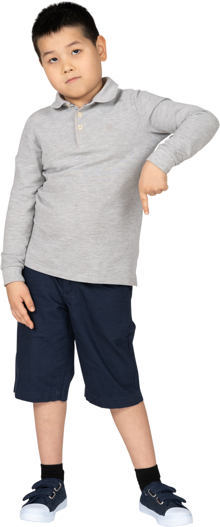 Little boy pointing down Photo
