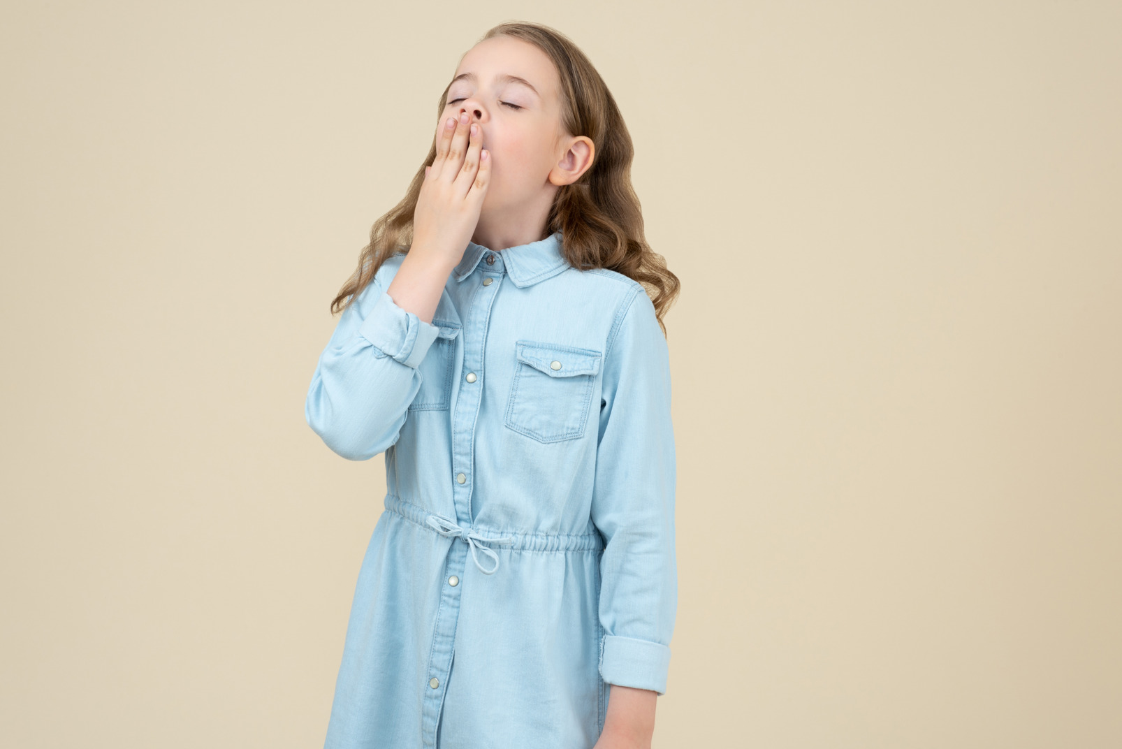 Cute little girl yawning Photo