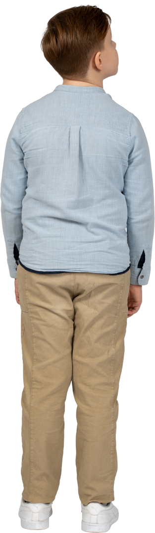 Back view of a boy looking up Photo