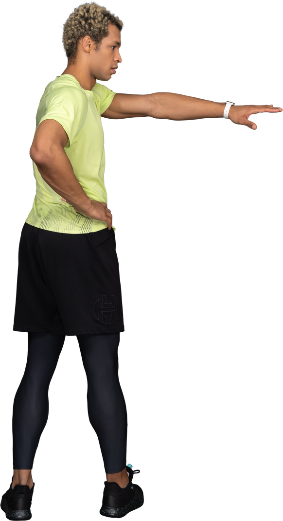 Back view of a dark-skinned young man turning right and outstretching ...