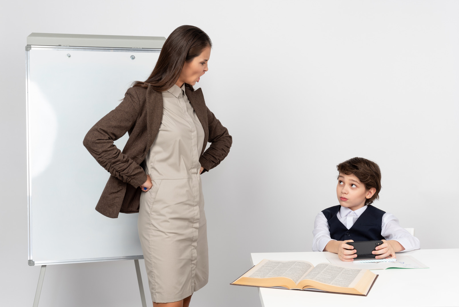 Angry young teacher and ignoring student Photo