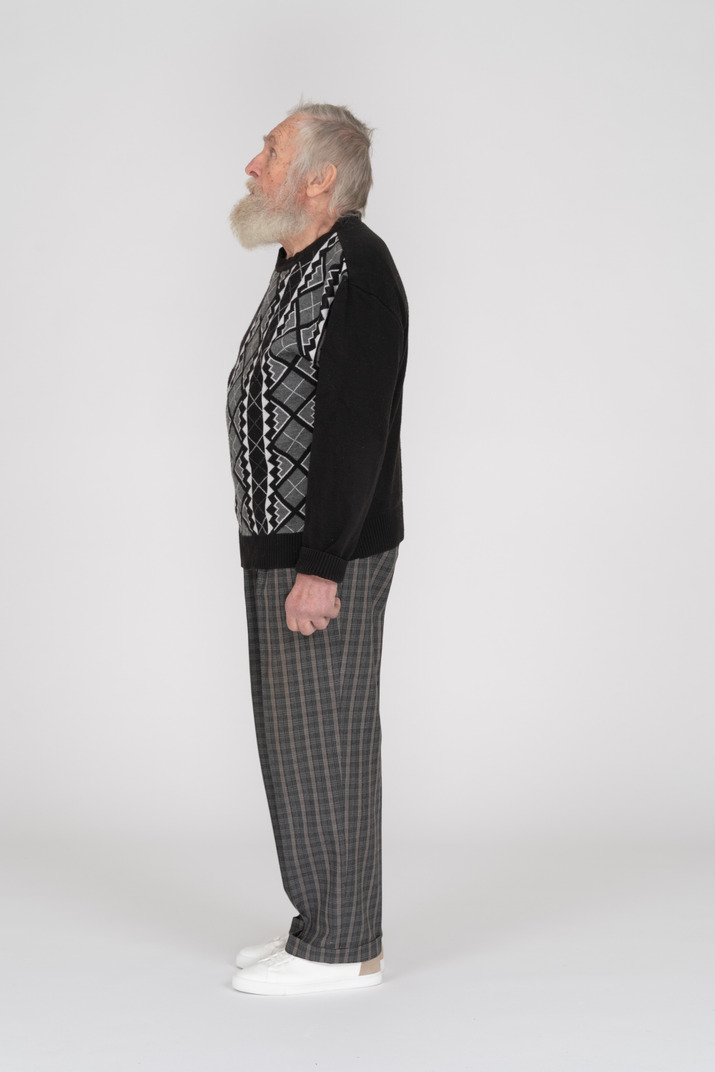 Side view of an old man standing Photo