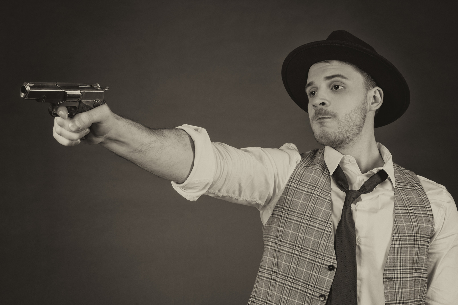 Gangster Pointing A Gun Sideways Photo