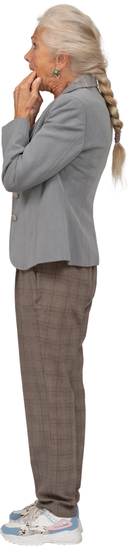 Side view of an old lady whistling Photo