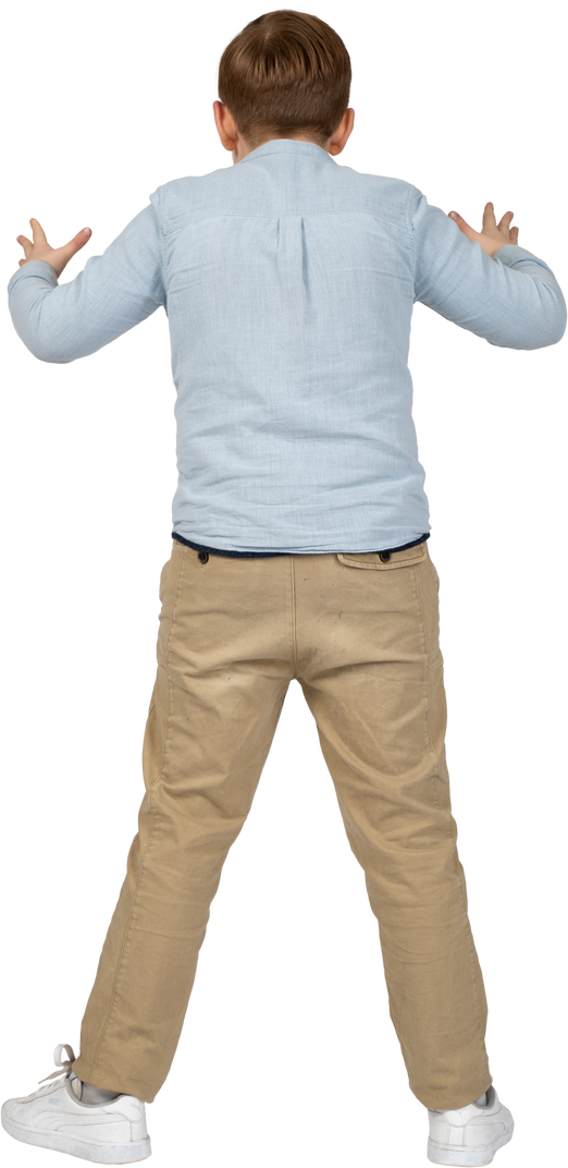 Back view of a boy scaring someone Photo