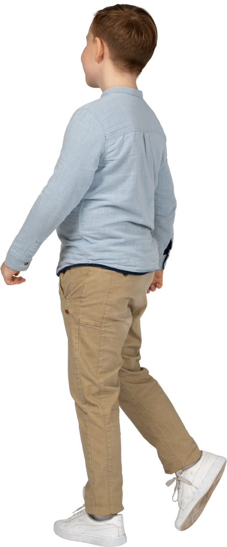 Side view of a boy walking Photo